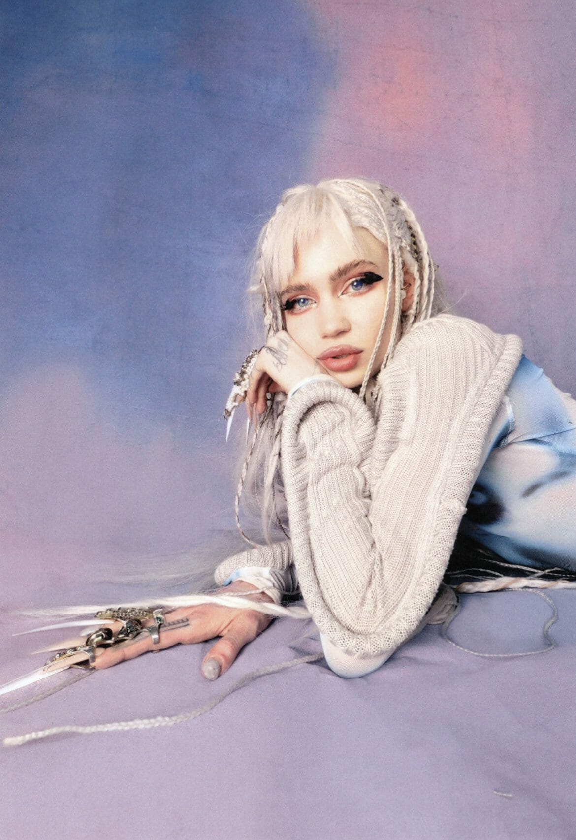 Grimes: AI Girl Group "NPC" and Their New Single • Music Daily